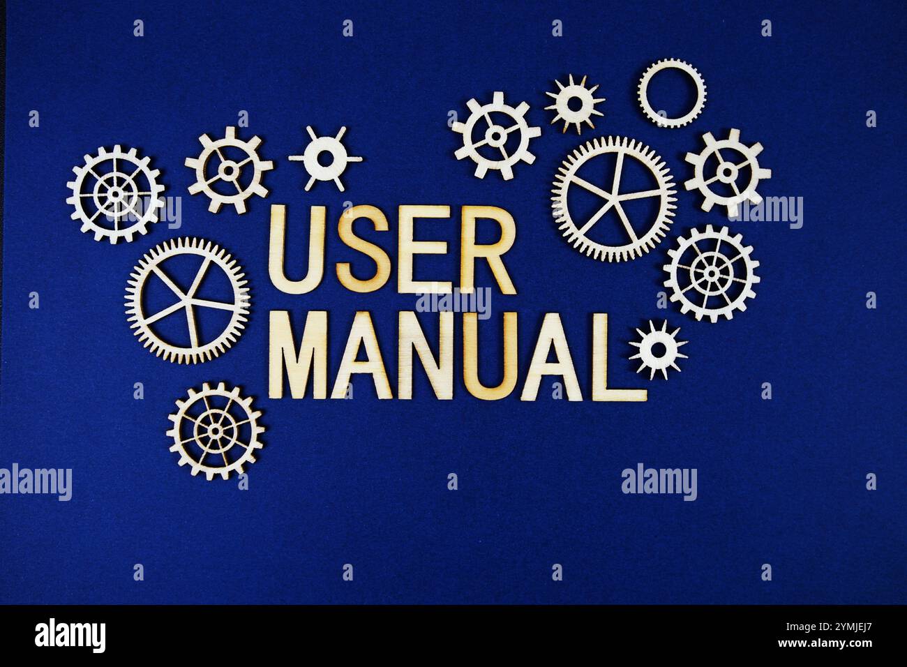 User Manual alphabet letters with gears element on navy blue background ...