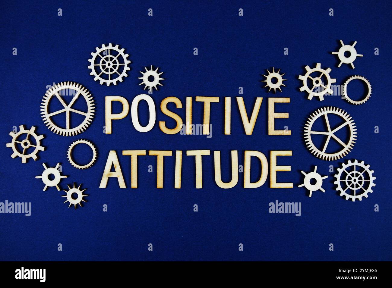 Positive Attitude alphabet letters with gears element on navy blue ...