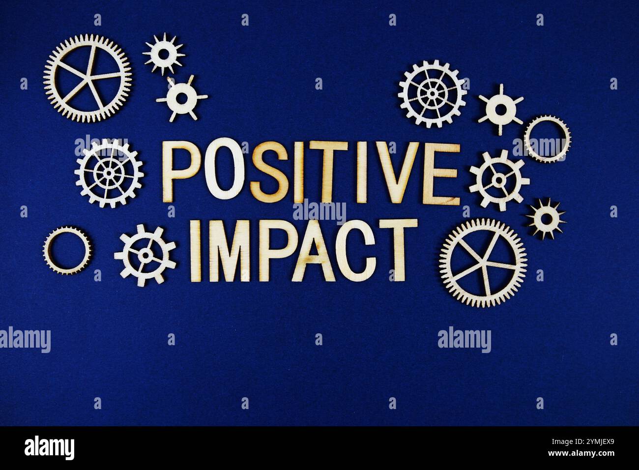 Positive Impact alphabet letters with gears element on navy blue ...