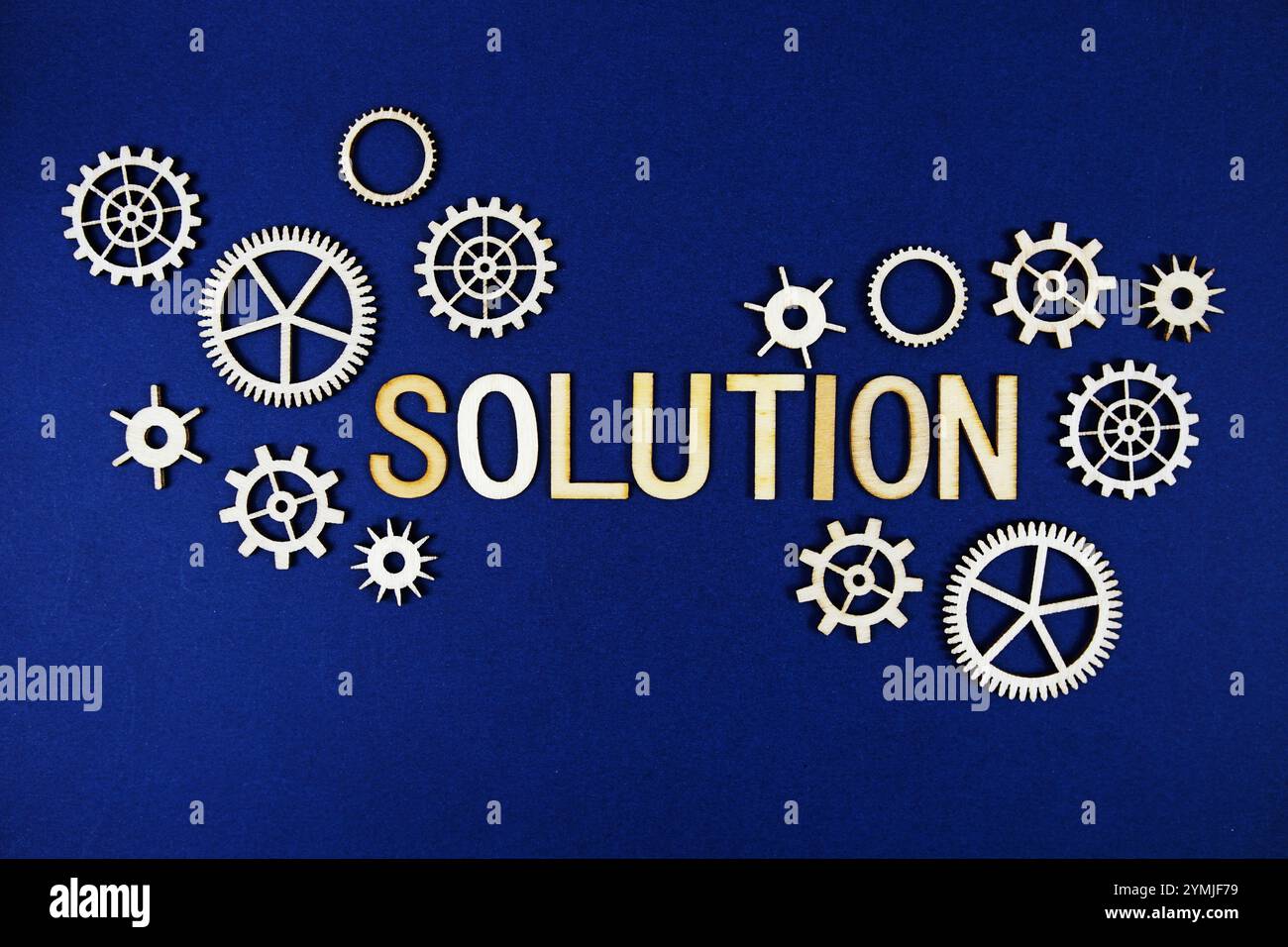Solution alphabet letters with gears element on navy blue background ...