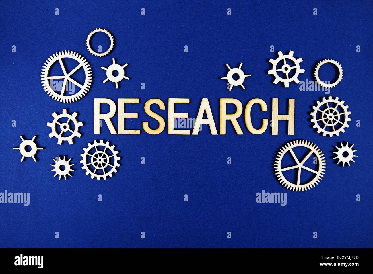 Research alphabet letters with gears element on navy blue background ...