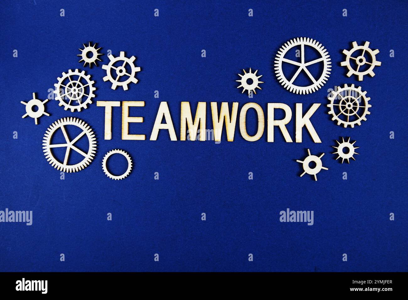 Teamwork alphabet letters with gears element on navy blue background ...