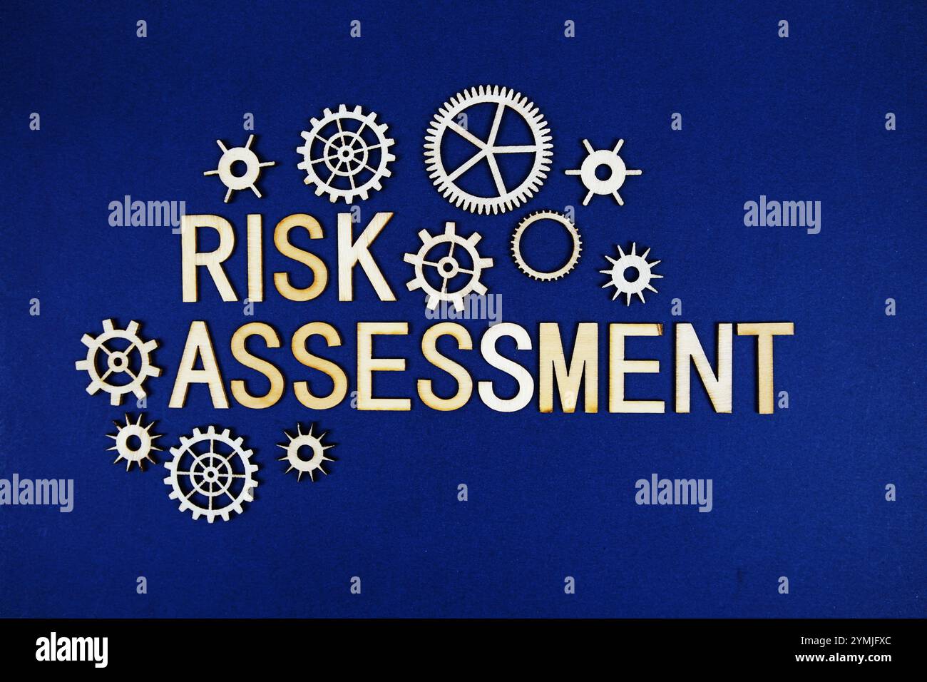 Risk Assessment alphabet letters with gears element on navy blue ...