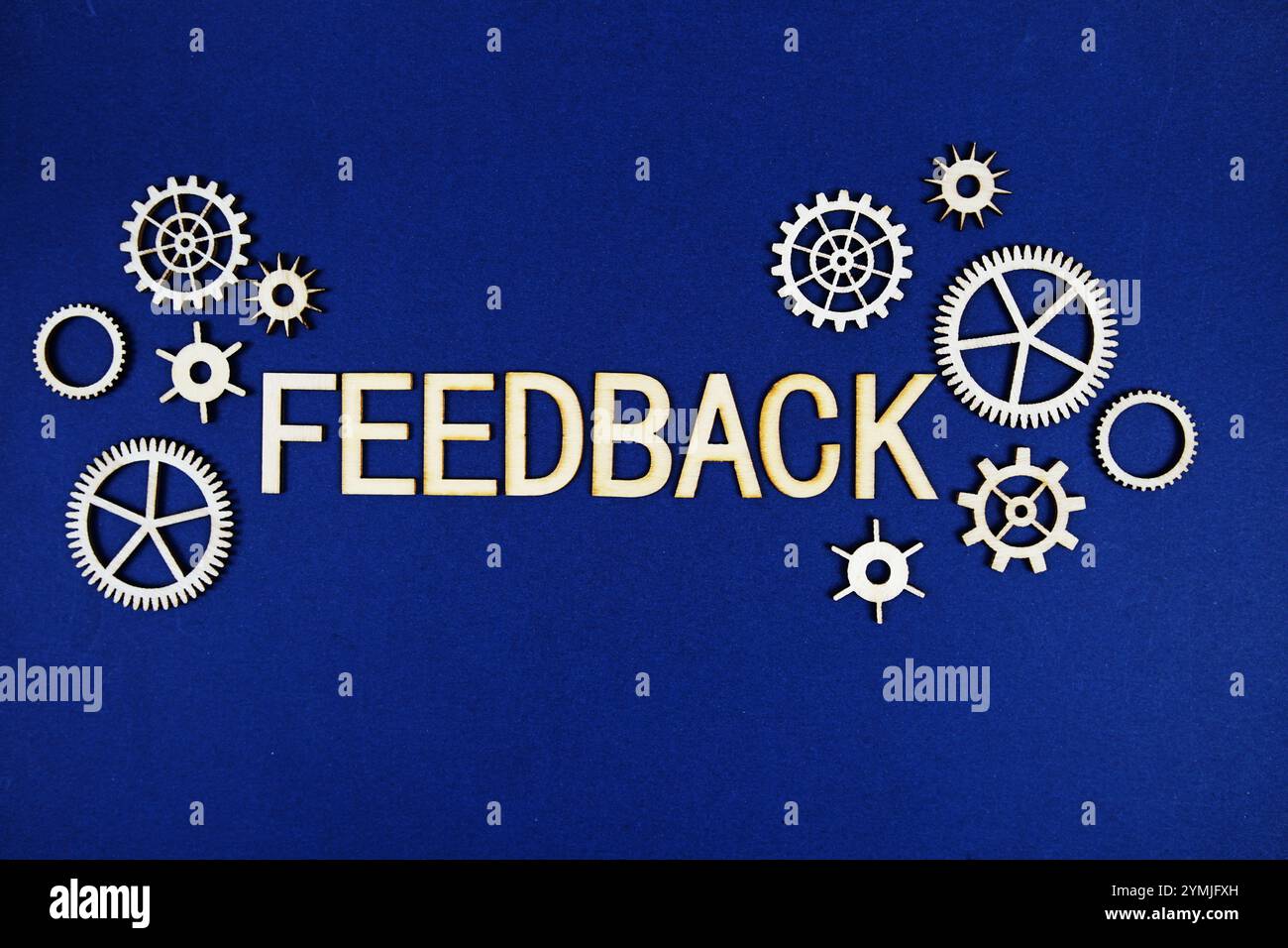 Feedback alphabet letters with gears element on navy blue background ...