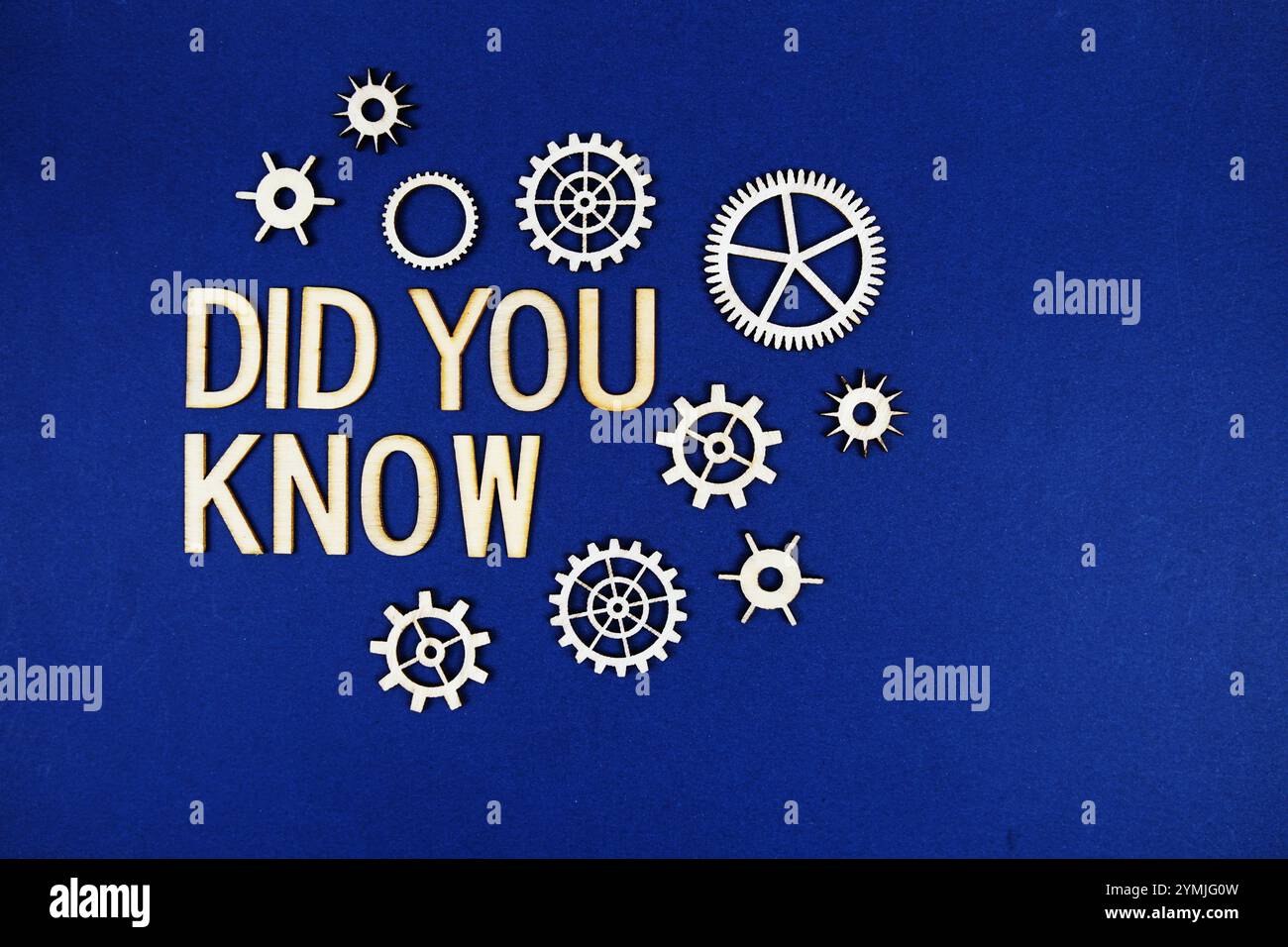Did You Know alphabet letters with gears element on navy blue ...