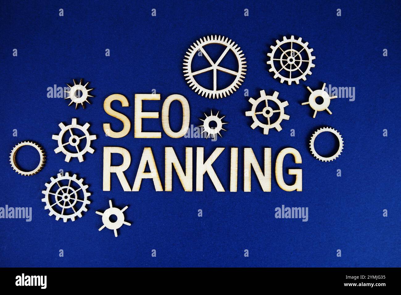 SEO Ranking alphabet letters with gears element on navy blue background ...
