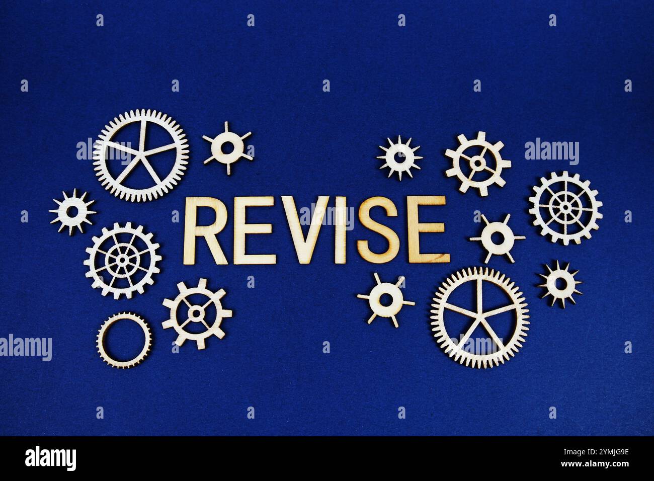 Revise alphabet letters with gears element on navy blue background ...