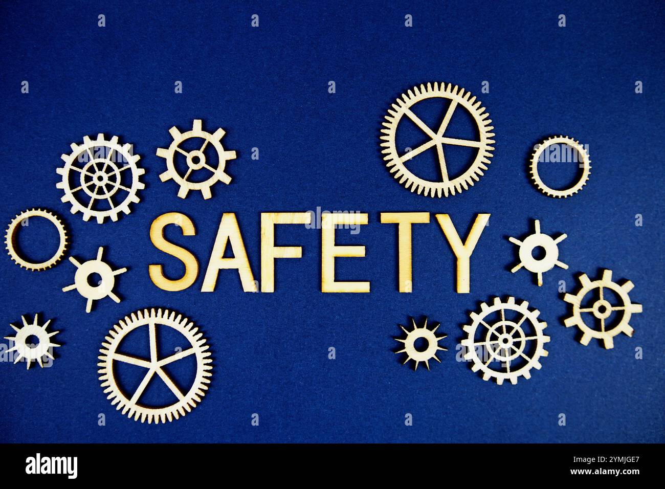 Safety alphabet letters with gears element on navy blue background ...