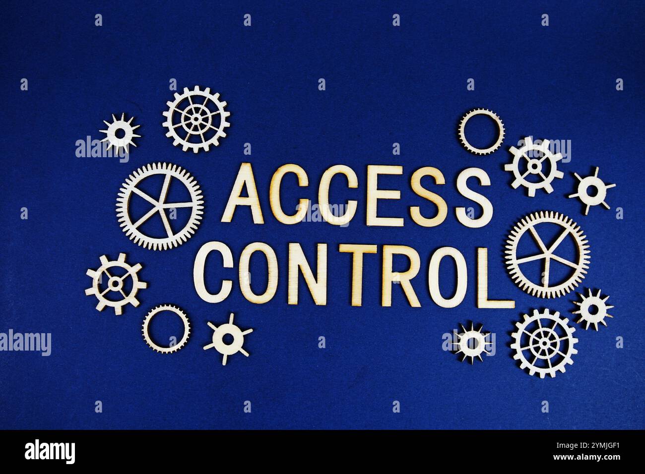 Access Control alphabet letters with gears element on navy blue ...