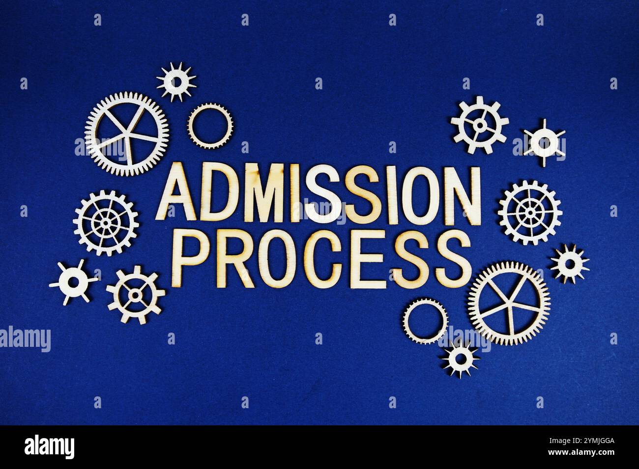 Admission Process alphabet letters with gears element on navy blue ...
