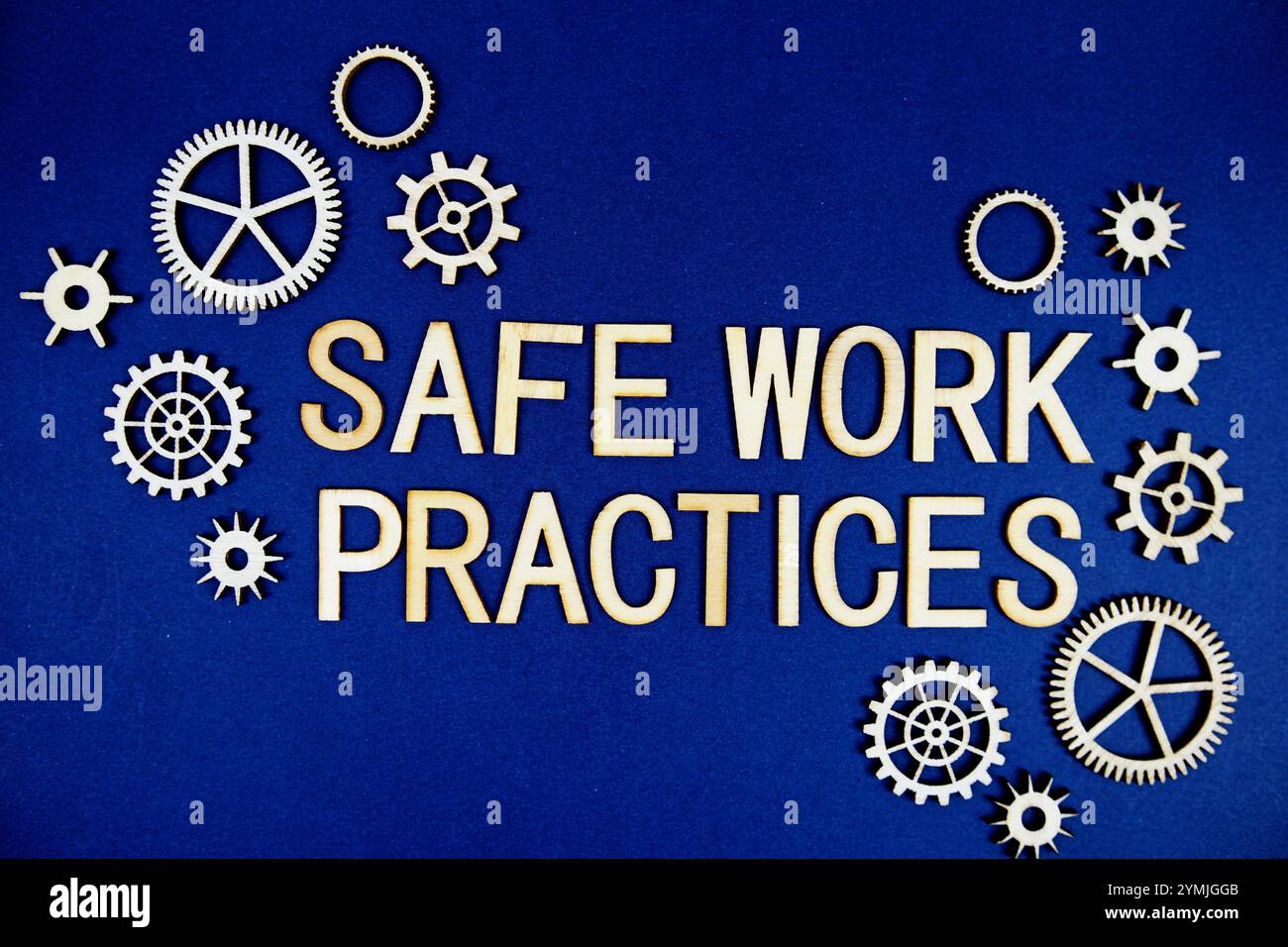 Safe Work Practices alphabet letters with gears element on navy blue ...