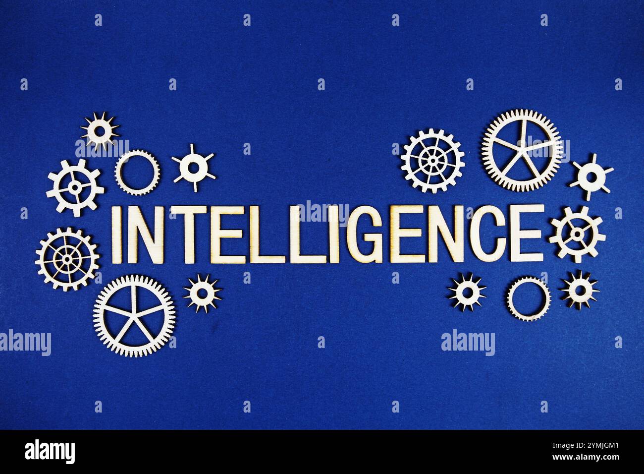 Intelligence alphabet letters with gears element on navy blue ...
