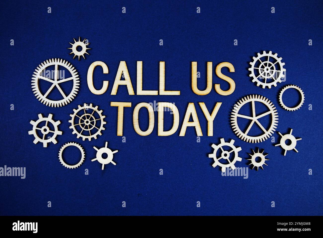 Call Us Today alphabet letters with gears element on navy blue ...
