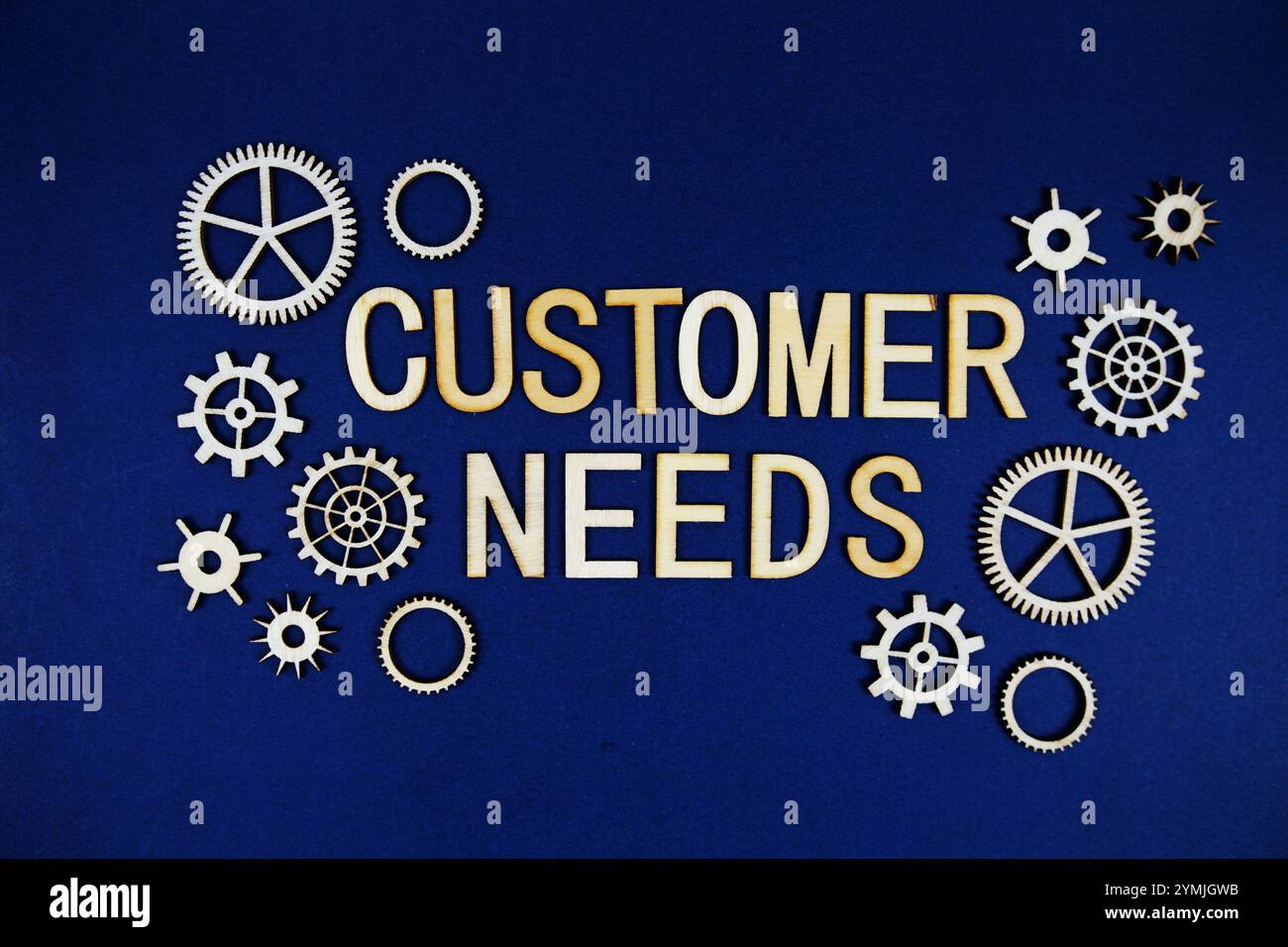 Customer Needs alphabet letters with gears element on navy blue ...