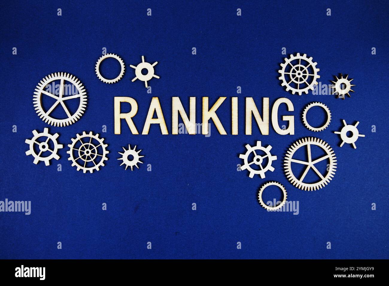 Ranking alphabet letters with gears element on navy blue background ...