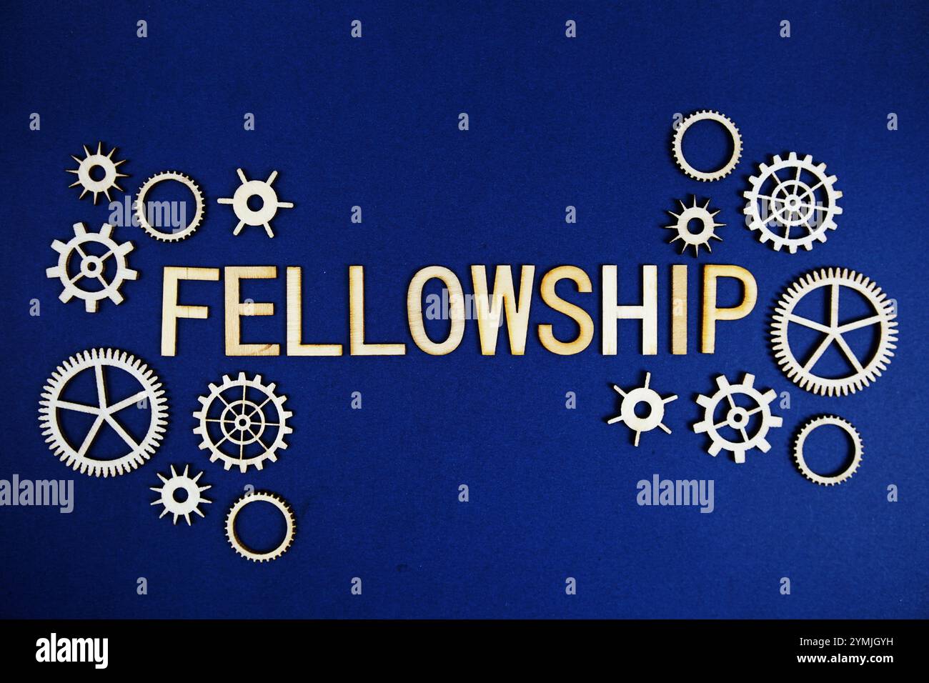Fellowship alphabet letters with gears element on navy blue background ...