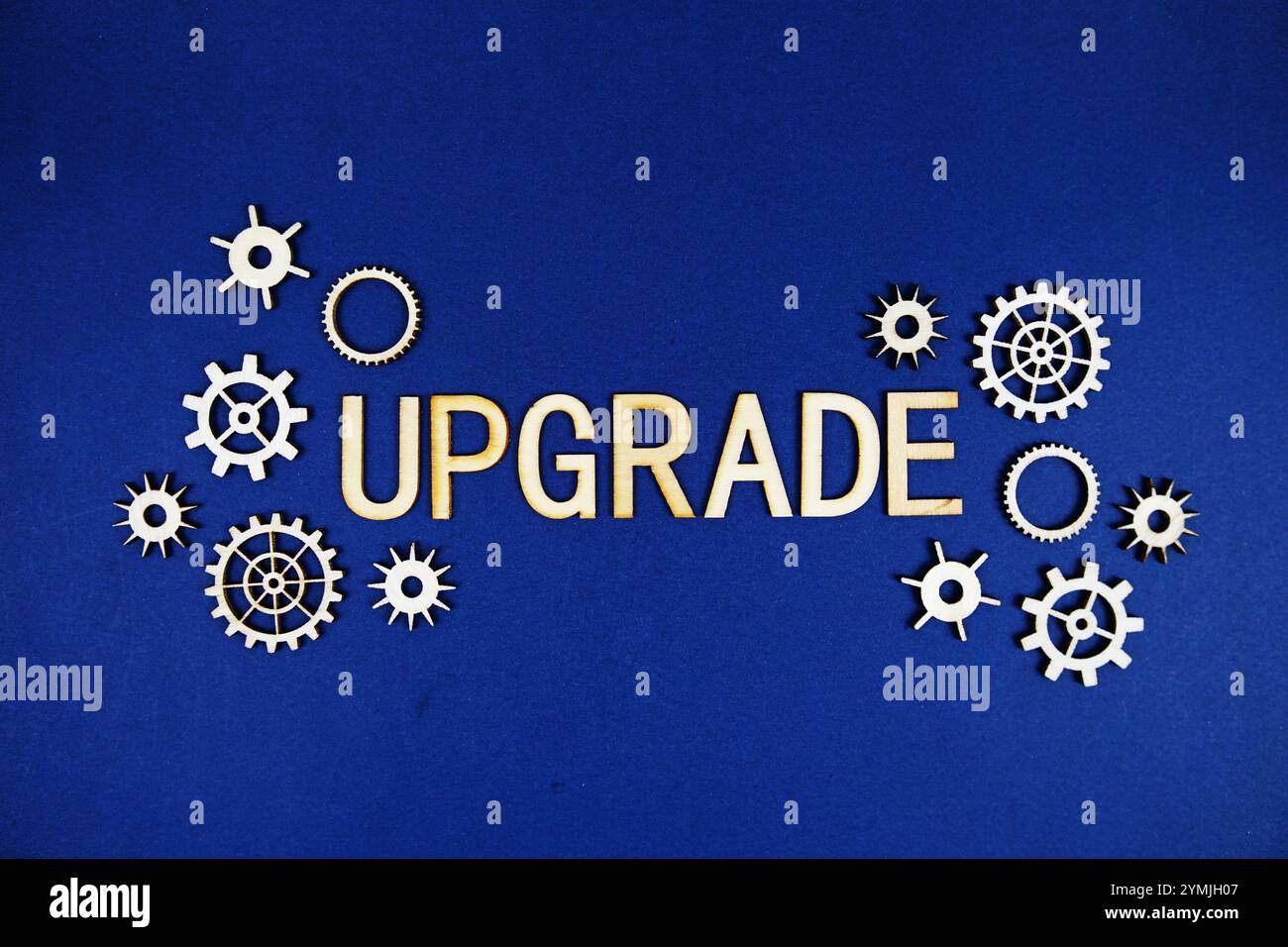 Upgrade alphabet letters with gears element on navy blue background ...