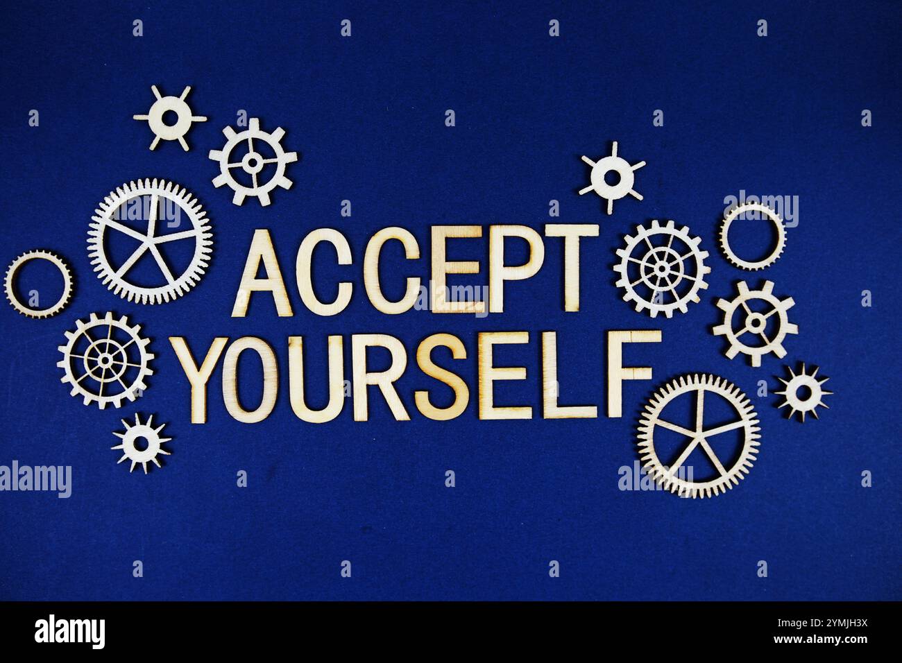 Accept Yourself alphabet letters with gears element on navy blue ...