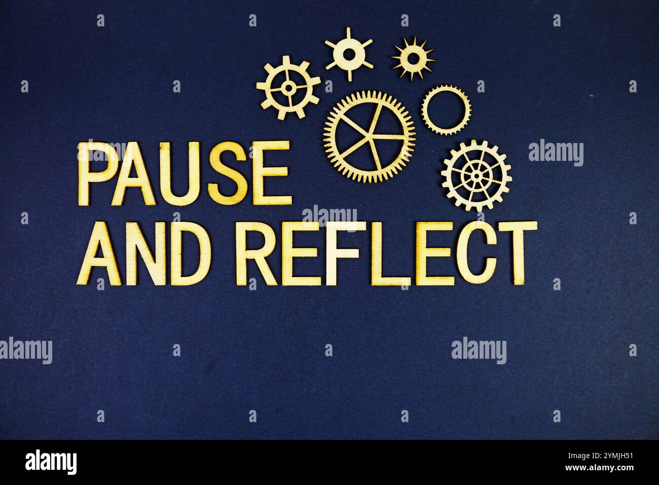 Pause and Reflect alphabet letters with gears element on navy blue ...