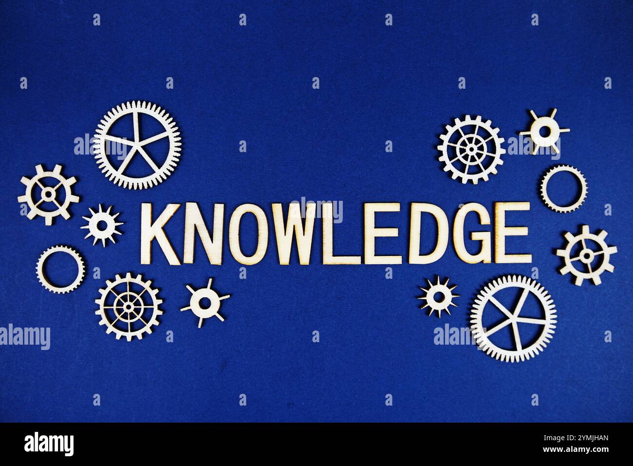 Knowledge alphabet letters with gears element on navy blue background ...