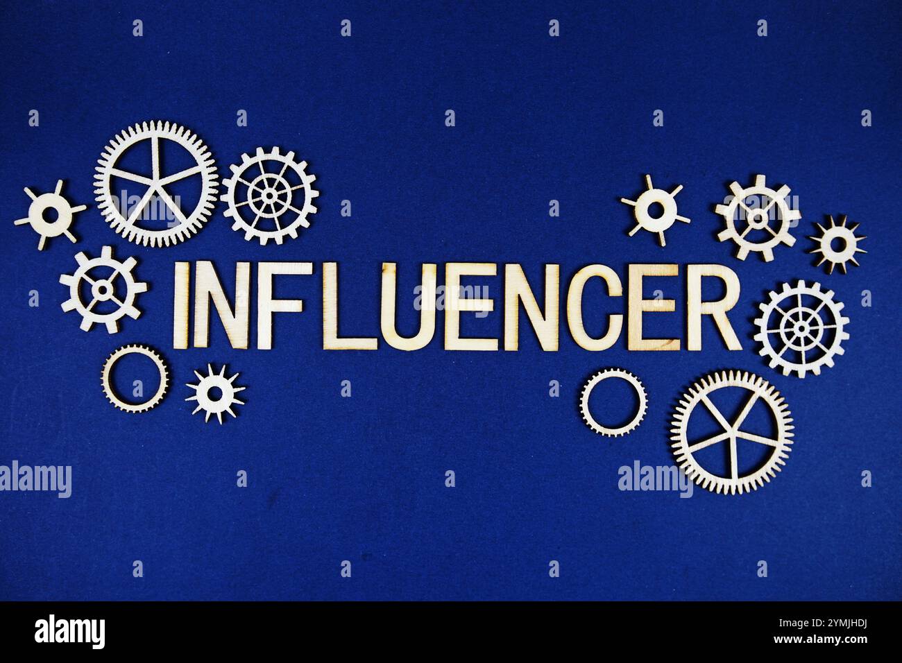 Influencer alphabet letters with gears element on navy blue background ...