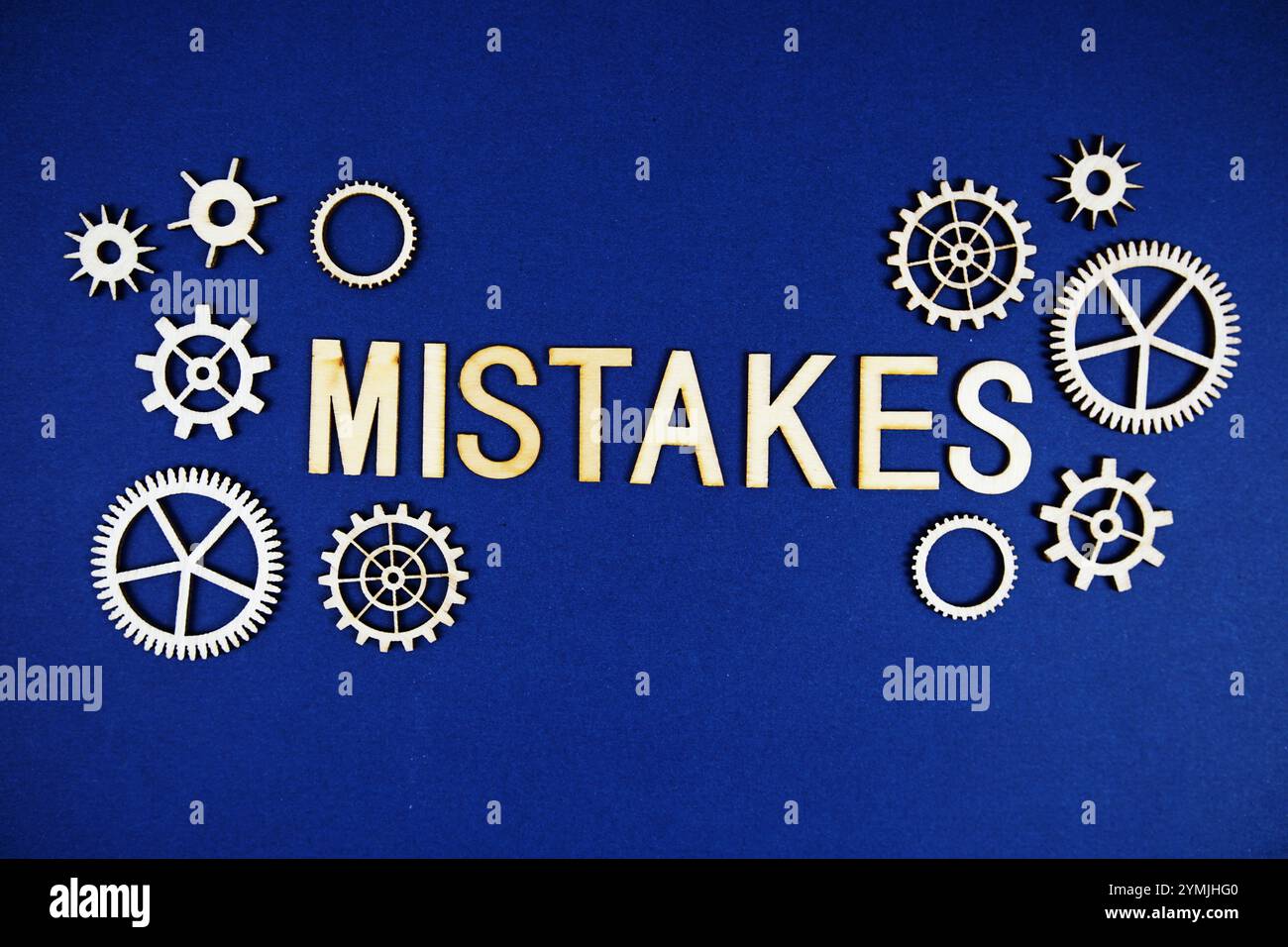 Mistake alphabet letters with gears element on navy blue background ...