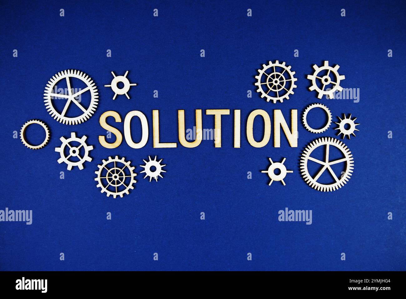 Solution alphabet letters with gears element on navy blue background ...