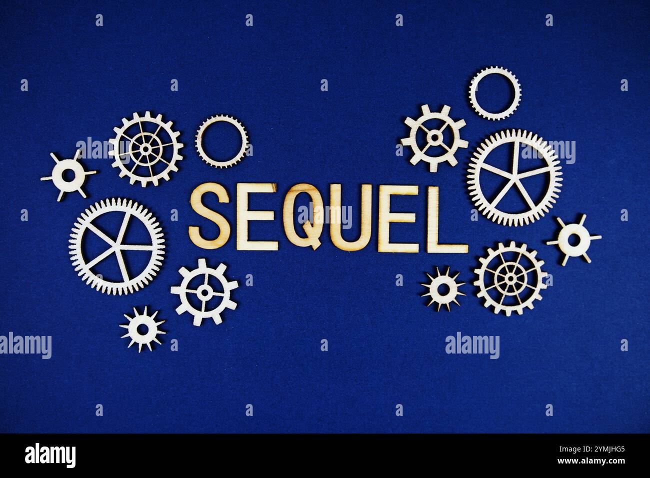 Sequel alphabet letters with gears element on navy blue background ...