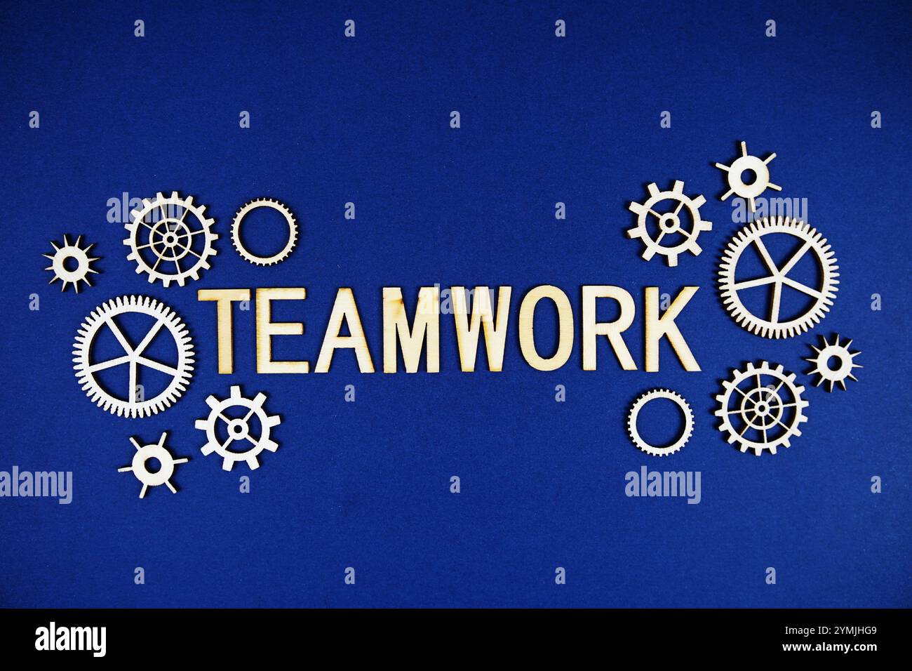 Teamwork alphabet letters with gears element on navy blue background ...