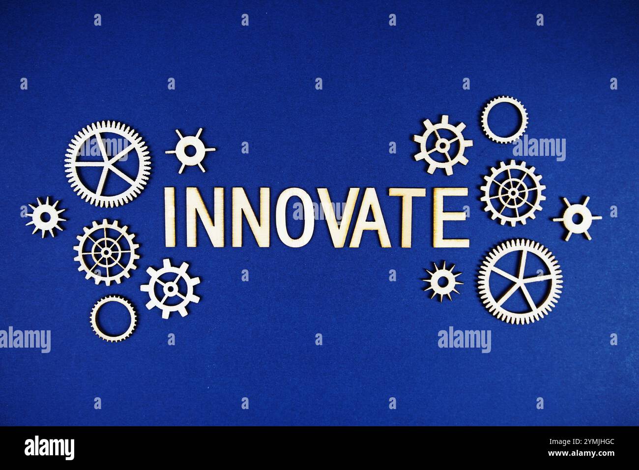 Innovate alphabet letters with gears element on navy blue background Stock Photo - Alamy