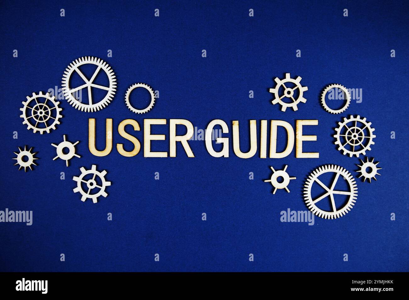 User Guide alphabet letters with gears element on navy blue background ...