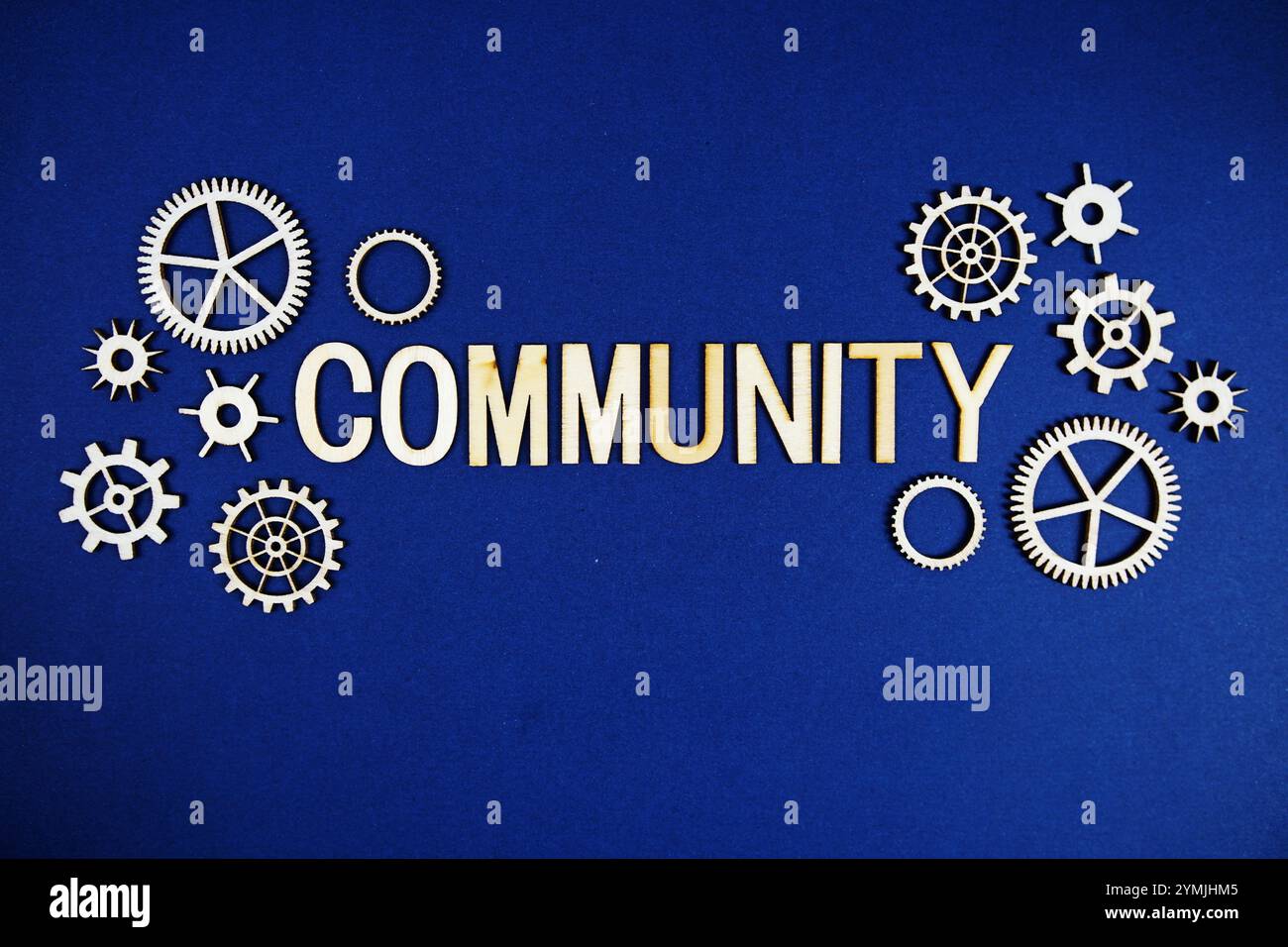 Community alphabet letters with gears element on navy blue background ...