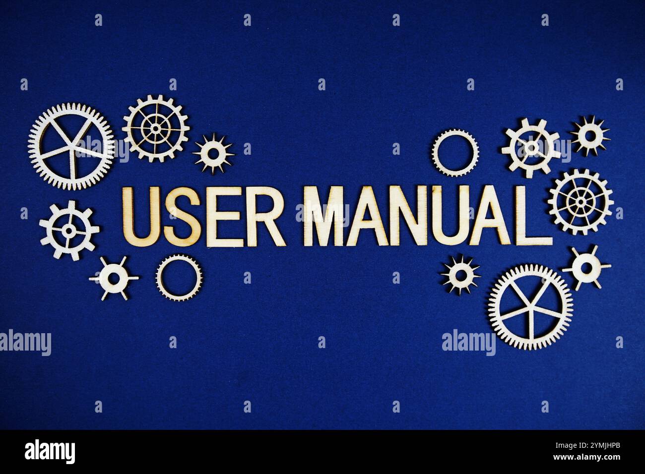User Manual alphabet letters with gears element on navy blue background ...