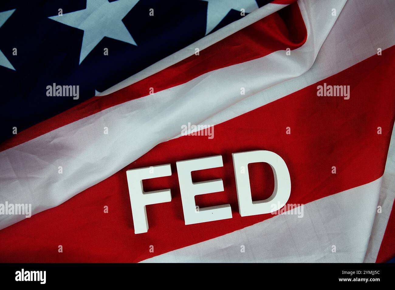 The Federal Reserve (FED) alphabet letters with USA flag background ...