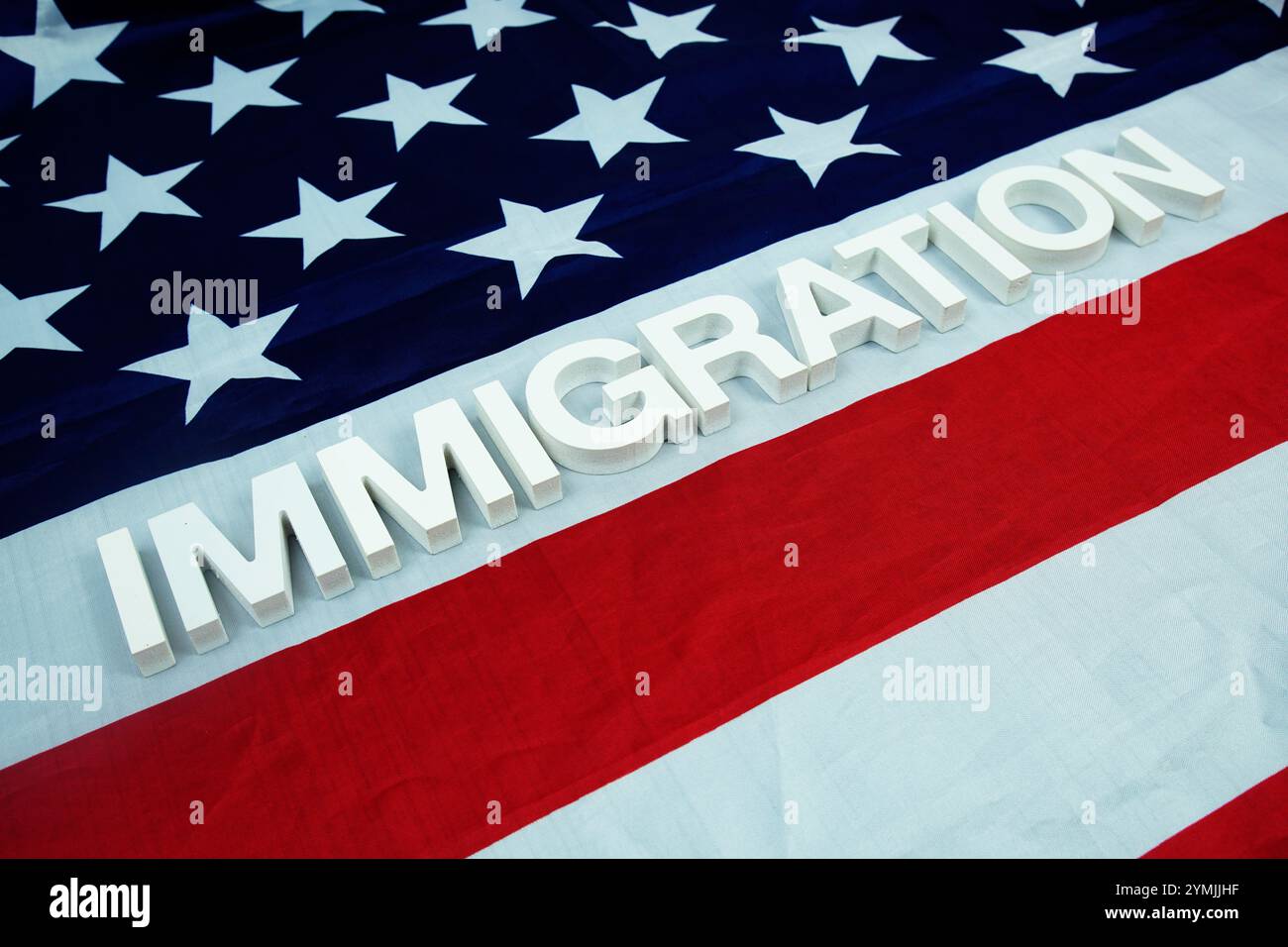 Immigration alphabet letters with USA flag background Stock Photo - Alamy
