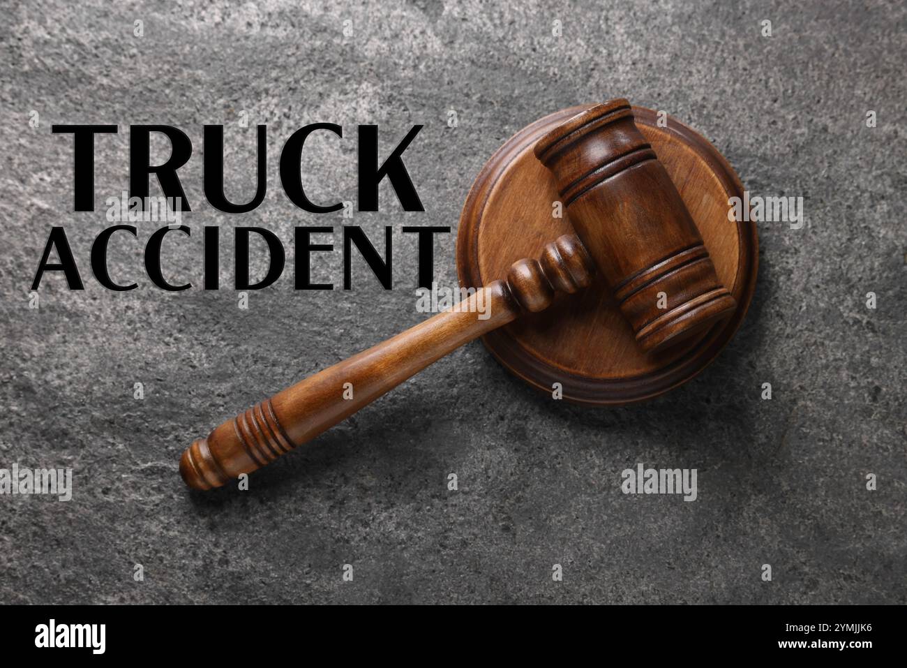 Truck accident law. Judge's gavel on grey table, top view Stock Photo ...