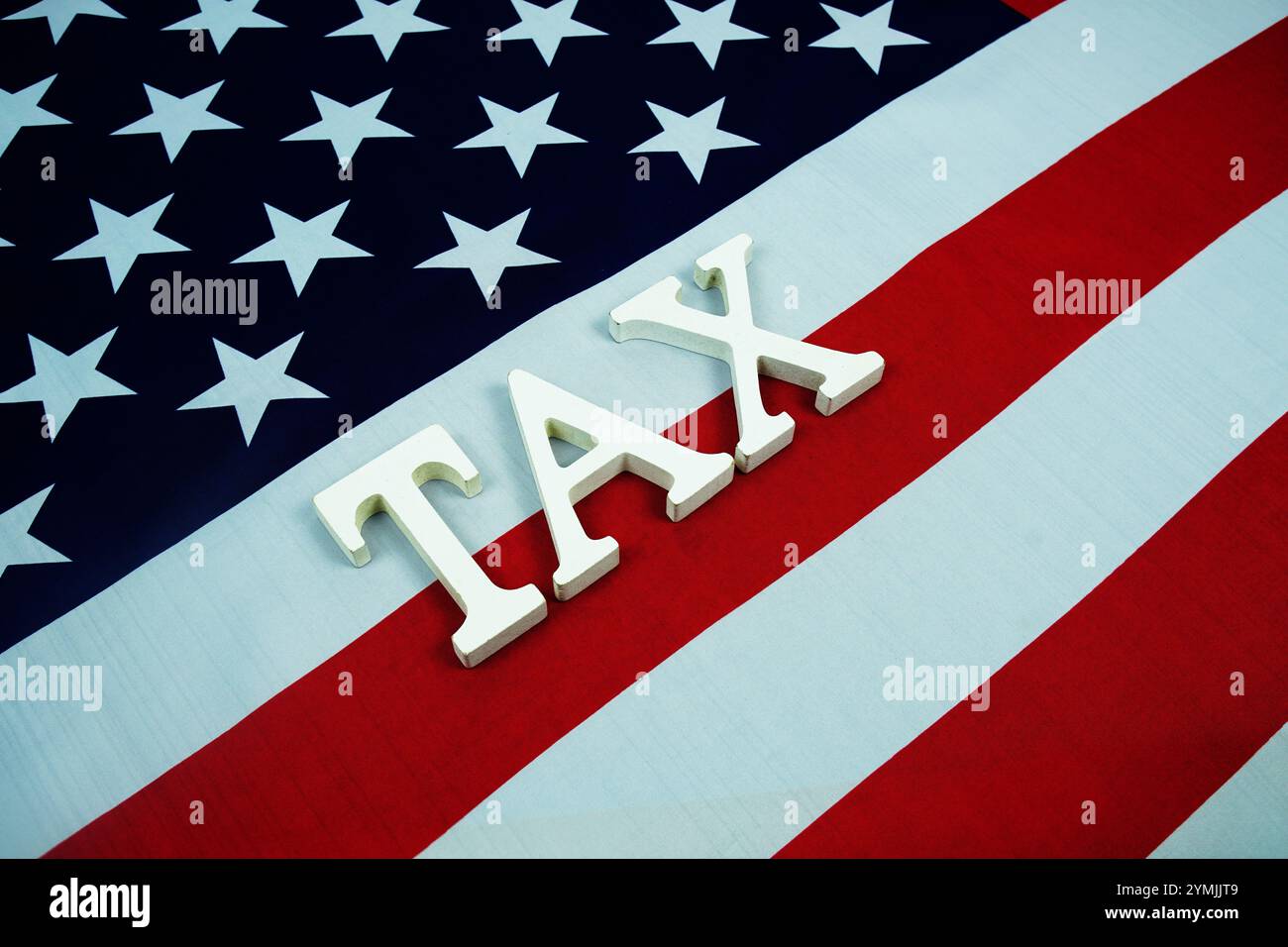 TAX alphabet letters with USA flag background Stock Photo - Alamy