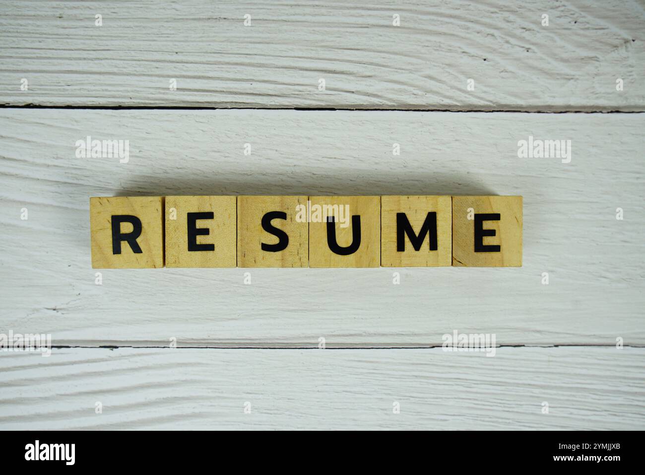 Resume alphabet letters top view on wooden background Stock Photo - Alamy