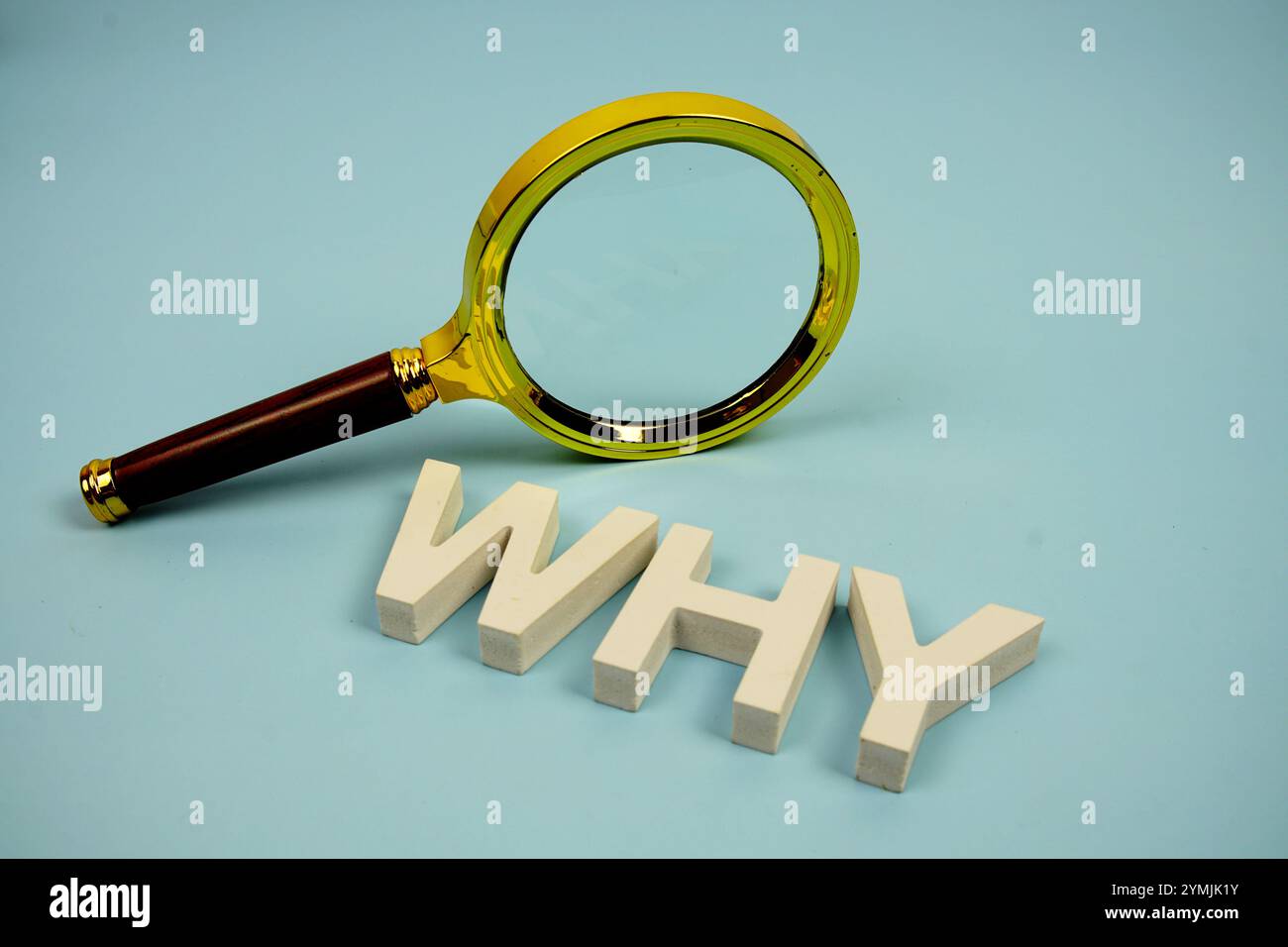 Why? word with magnifying glass on blue background Stock Photo - Alamy