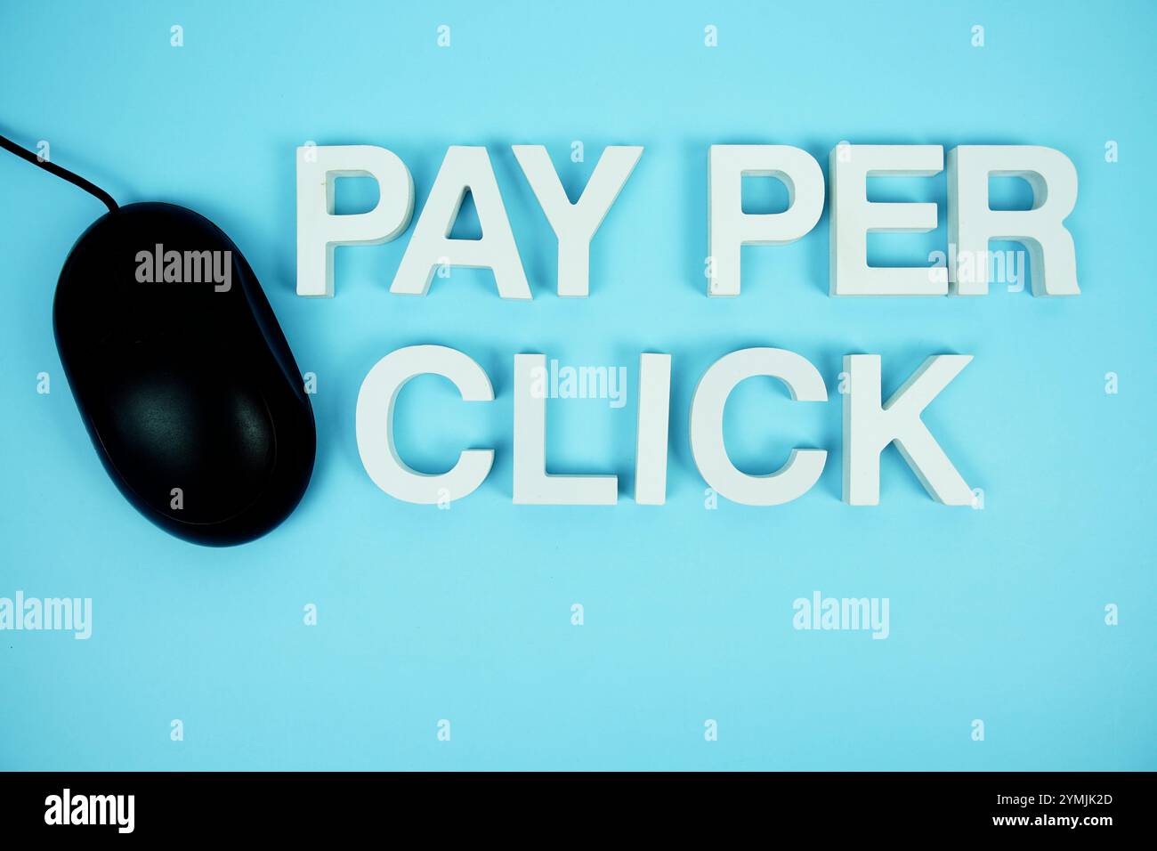 Pay Per Click alphabet letters and optical mouse top view on blue ...