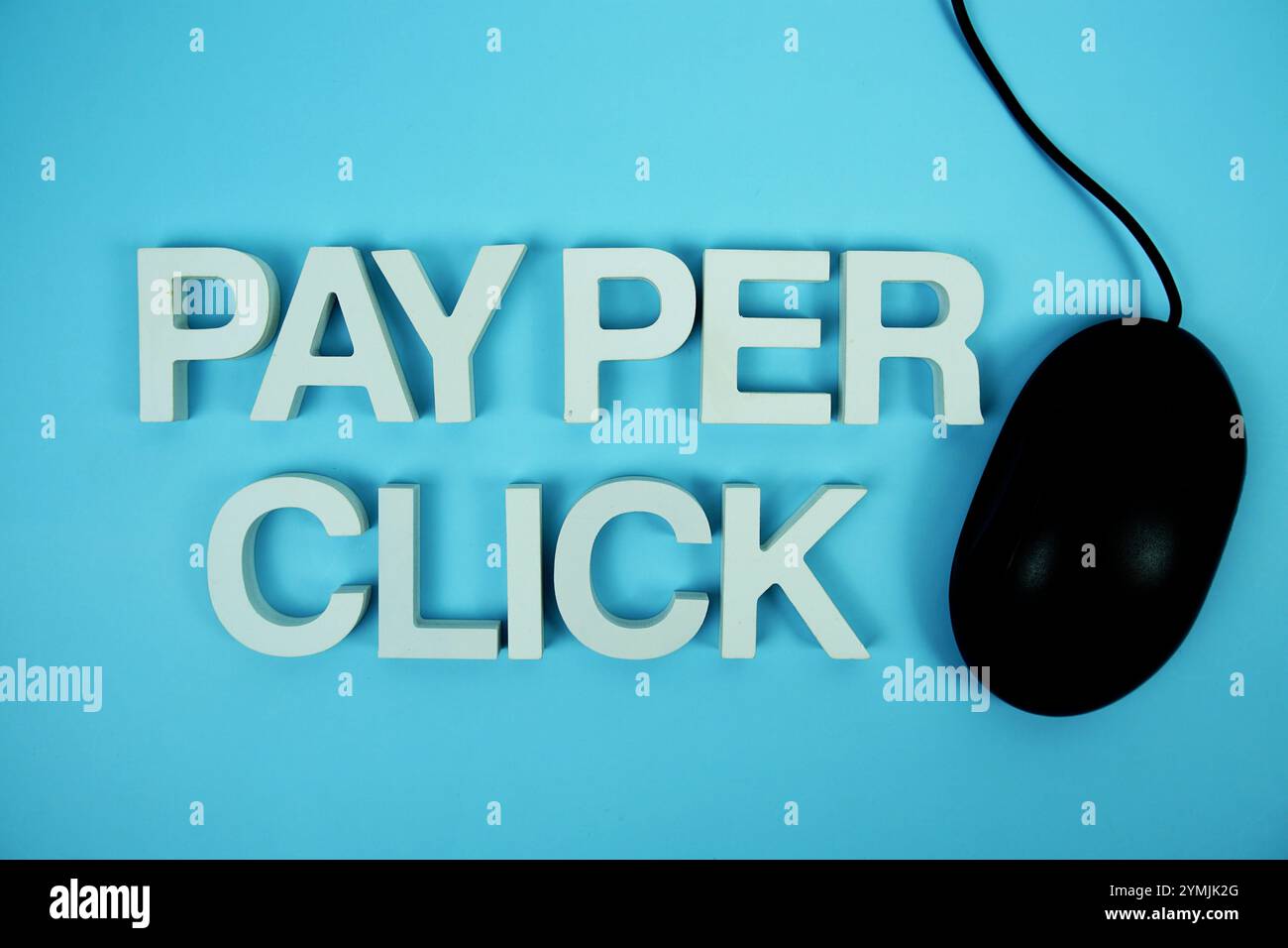 Pay Per Click alphabet letters and optical mouse top view on blue ...