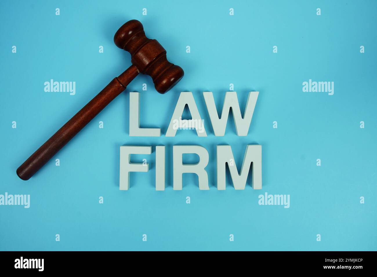 Law Firm alphabet letters with wooden judge gavel on blue background ...
