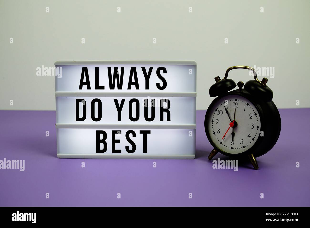 Always do your best text on LED lightbox with alarm clock on purple ...
