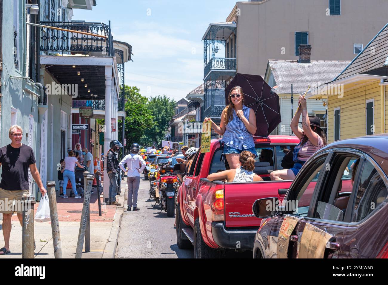 NEW ORLEANS, LA, USA - JUNE 13, 2020: Three women in truck bed holding ...