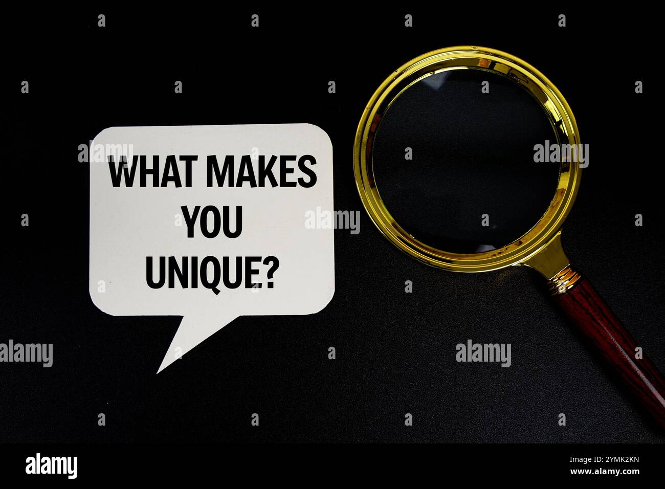 What makes you unique? text on bubble speech with magnifying glass top ...