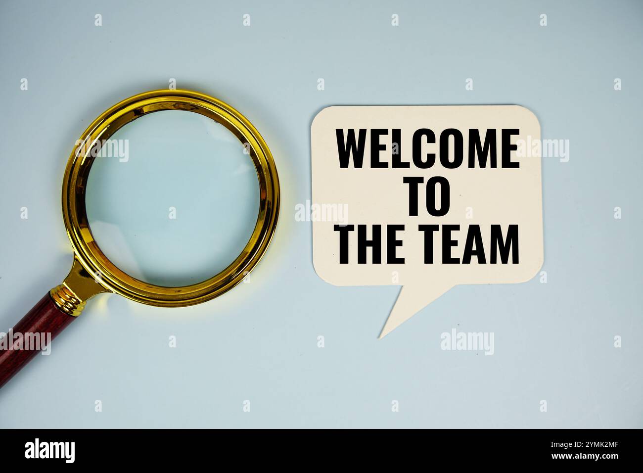 Welcome to the team text on speech bubble with magnifying glass top ...