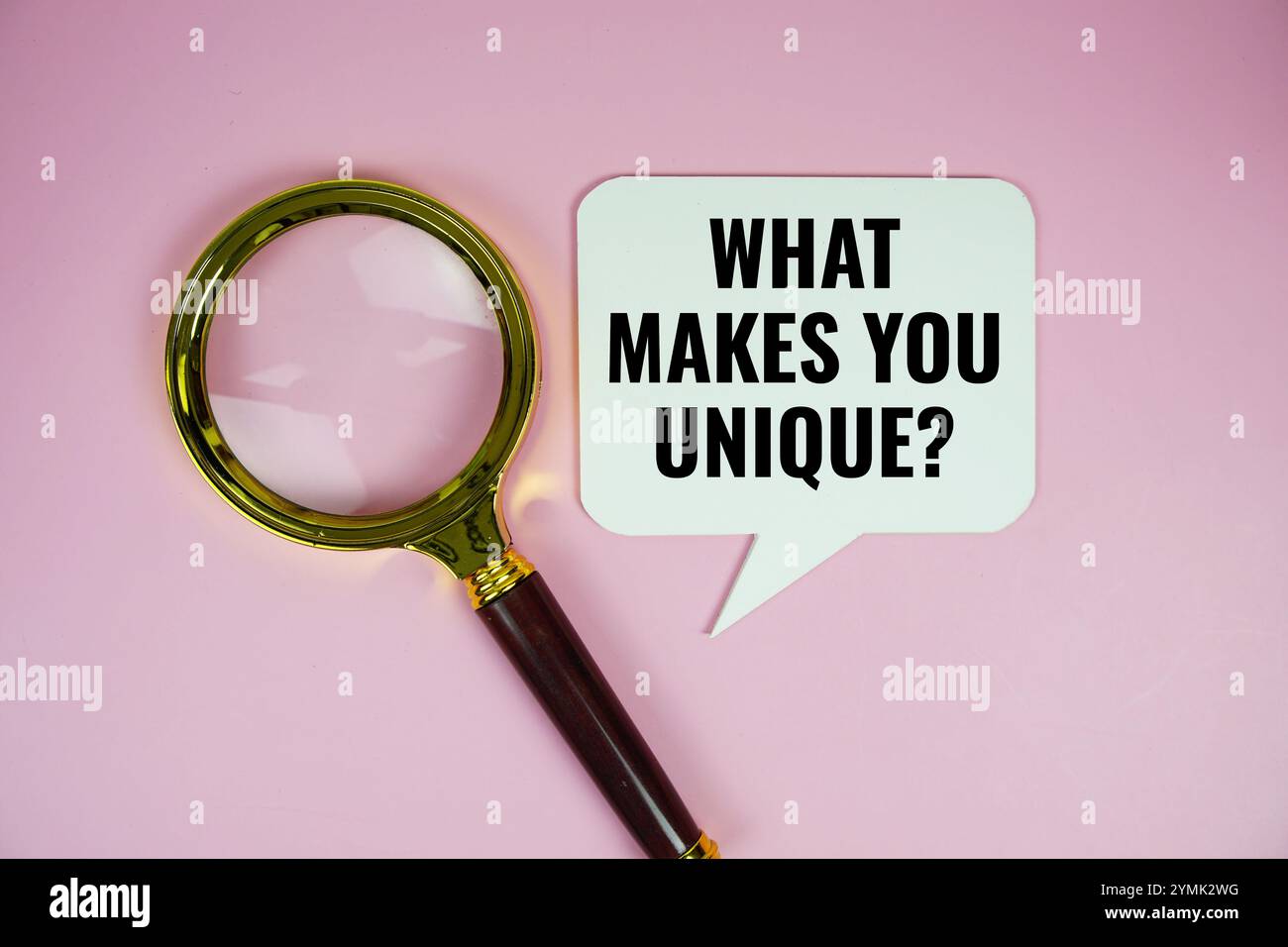 What makes you Unique? text on speech bubble with magnifying glass top ...