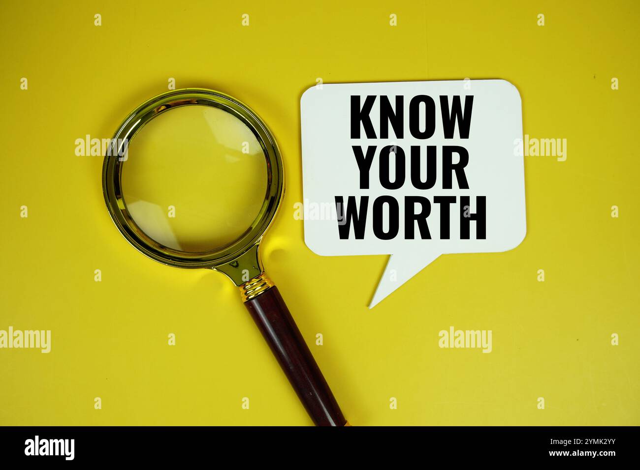 Know Your Worth text on speech bubble with magnifying glass top view on ...