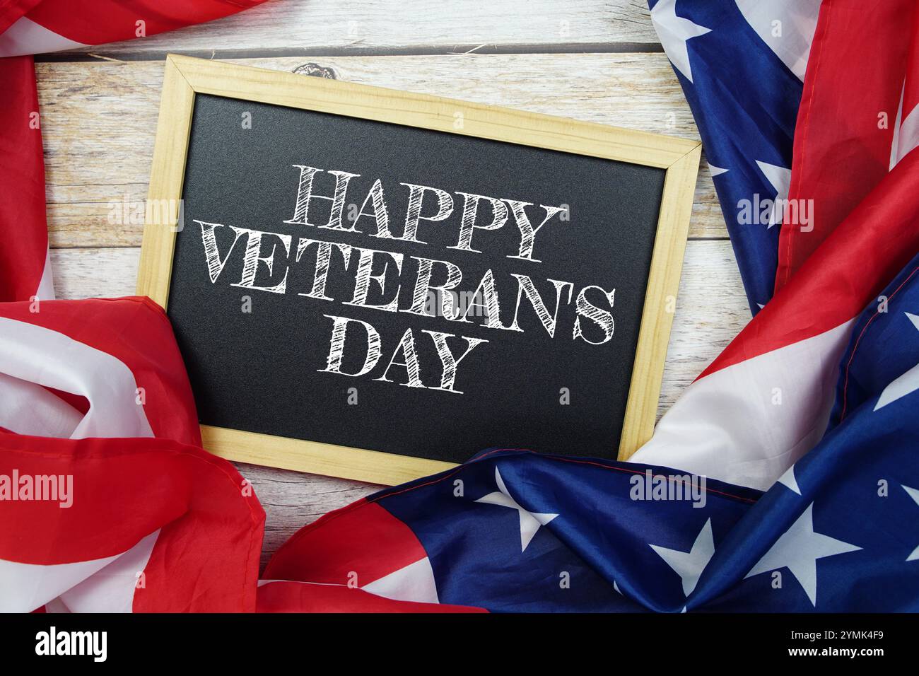 Happy Veterans Day text message with USA flag on wooden background ...