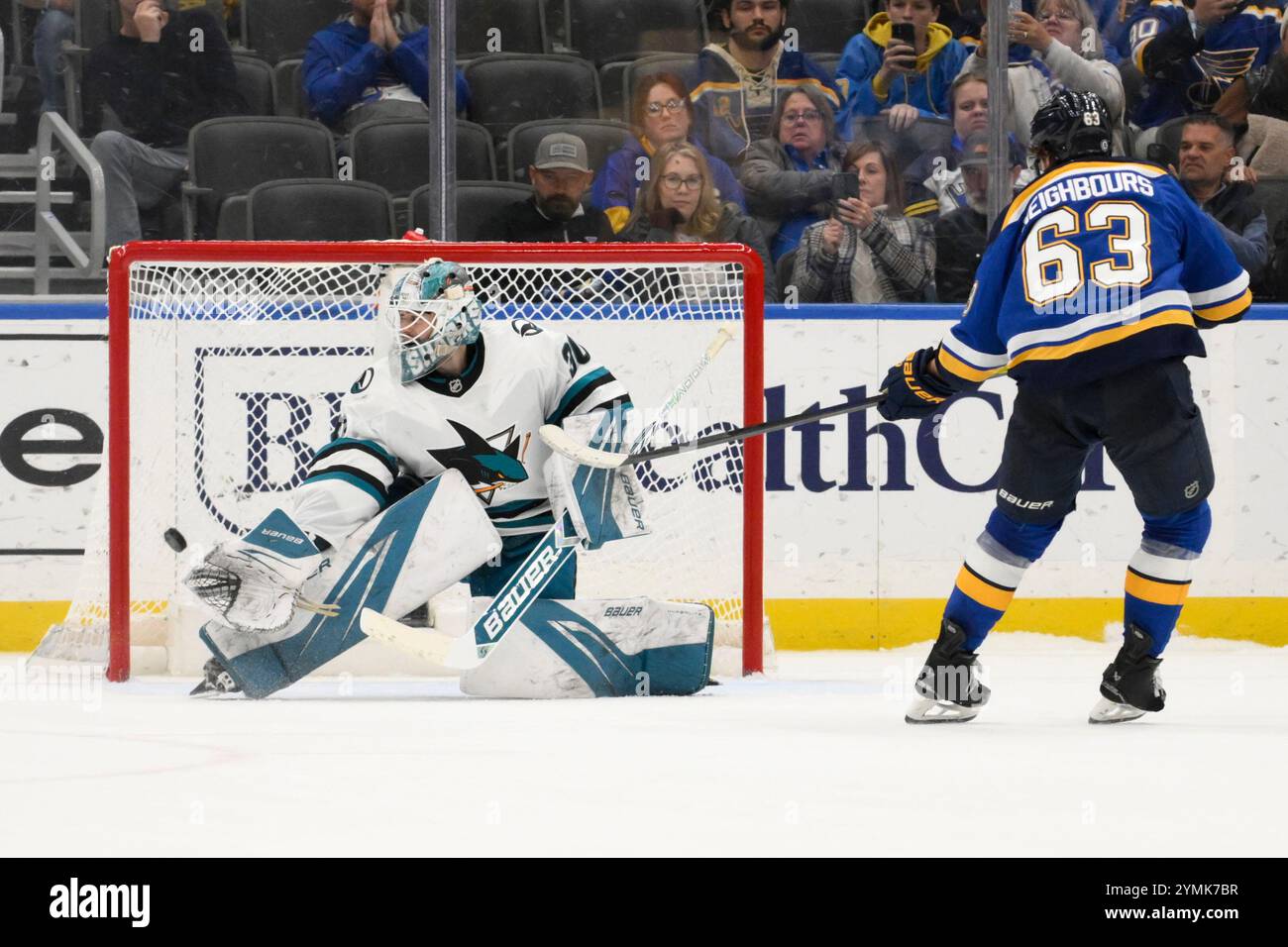 St. Louis Blues left wing Jake Neighbours (63) scores the winning goal ...